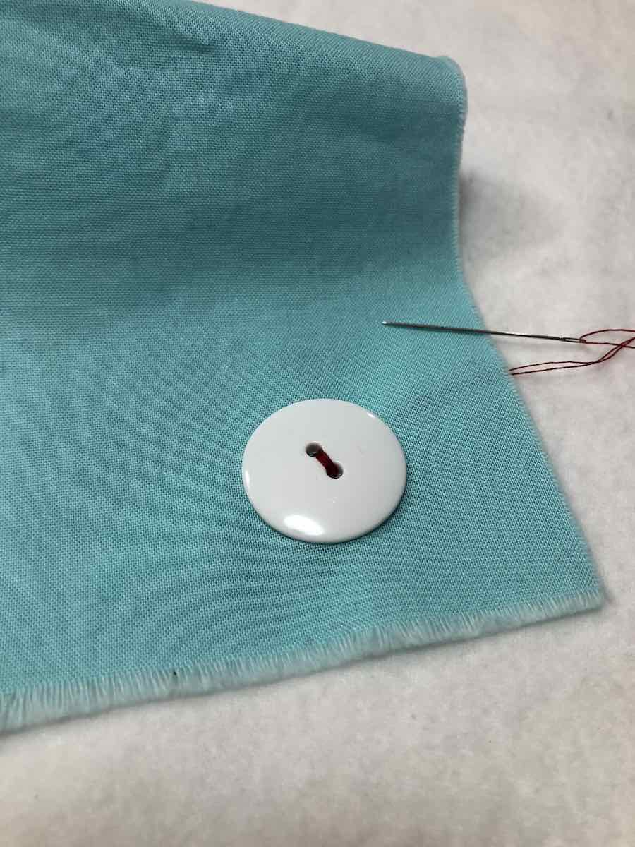 How to Sew a Two-hole Button By Hand