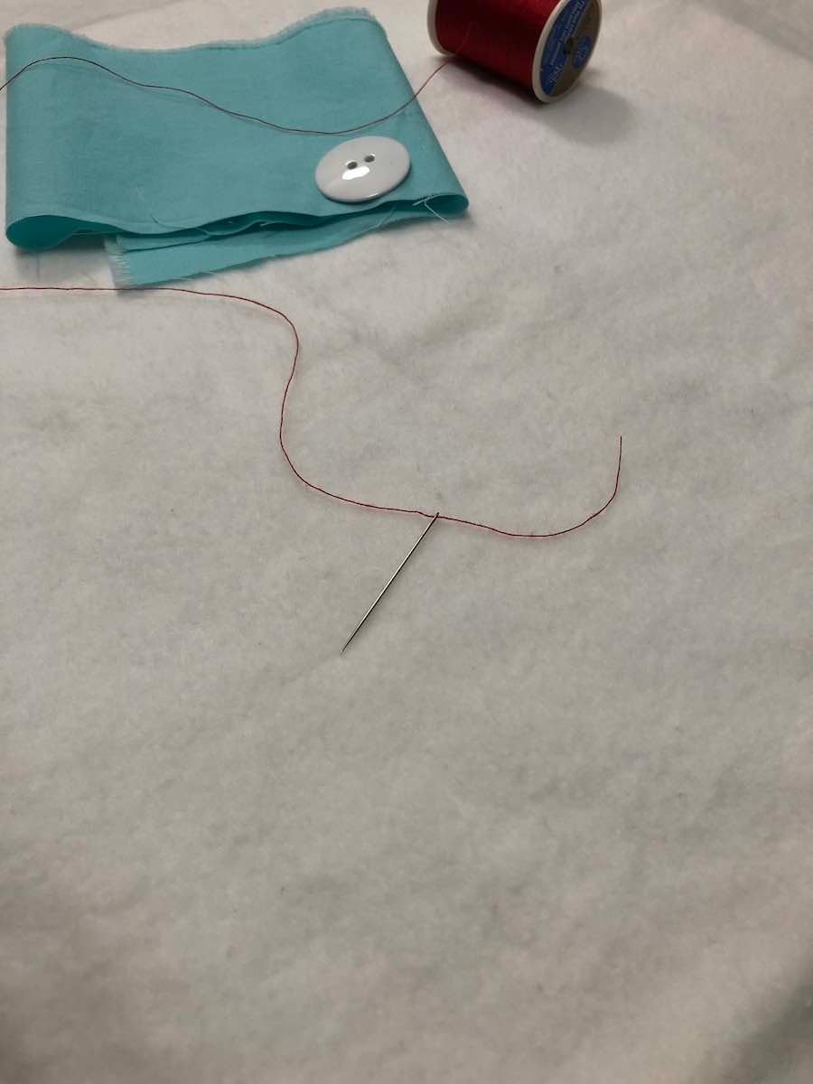 How to Sew a Two-hole Button By Hand