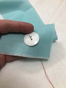 How to Sew a Two-hole Button By Hand